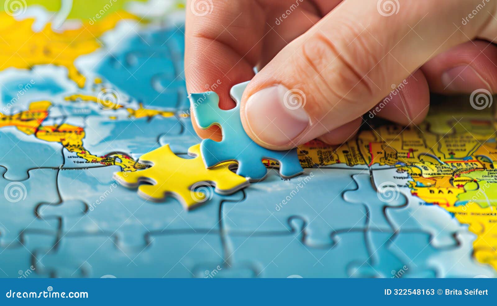 Hands Fitting a Jigsaw Puzzle Piece into Place, with a Clear View of ...