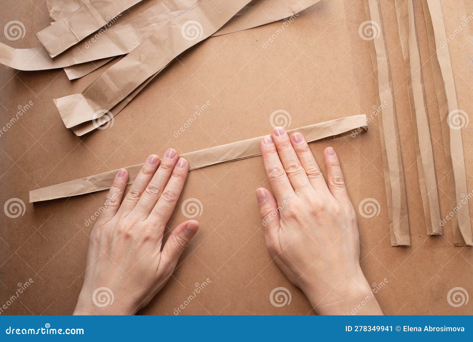 Hands Fold a Strip of Paper in Half Lengthwise Stock Image - Image of ...