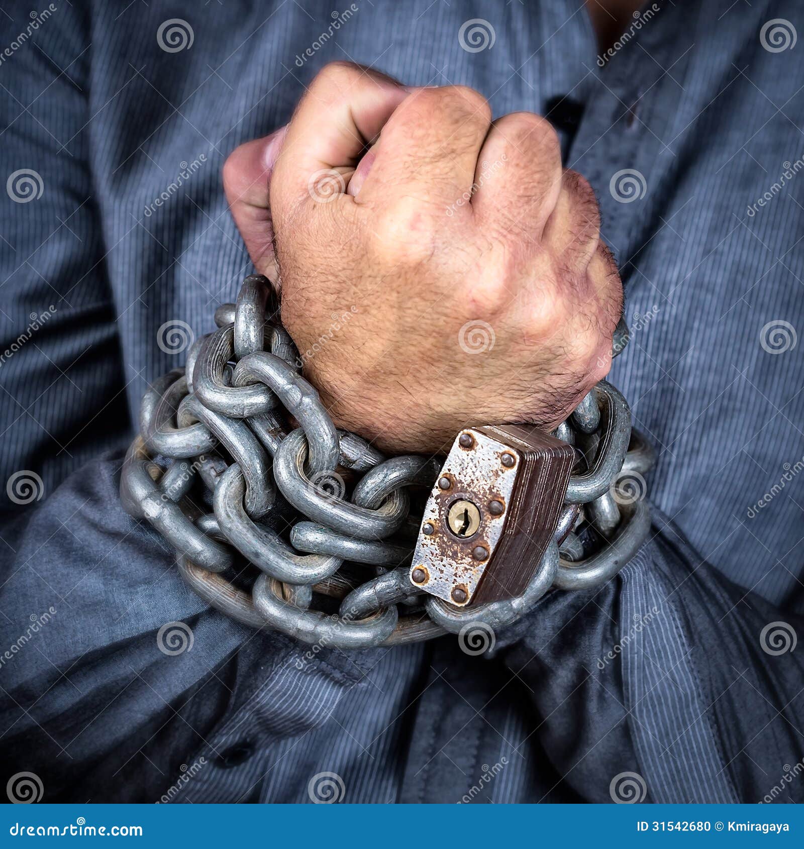 Hands of a Formally Dressed Man Chained with an Iron Chain and a Stock ...