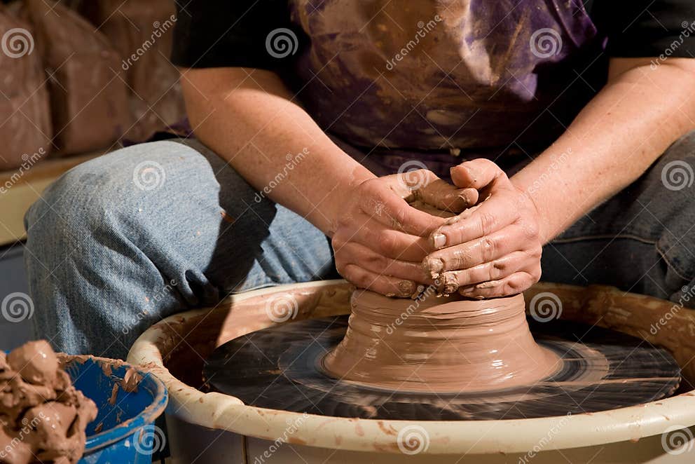 Hands forming clay stock image. Image of jeans, jigger - 12689753