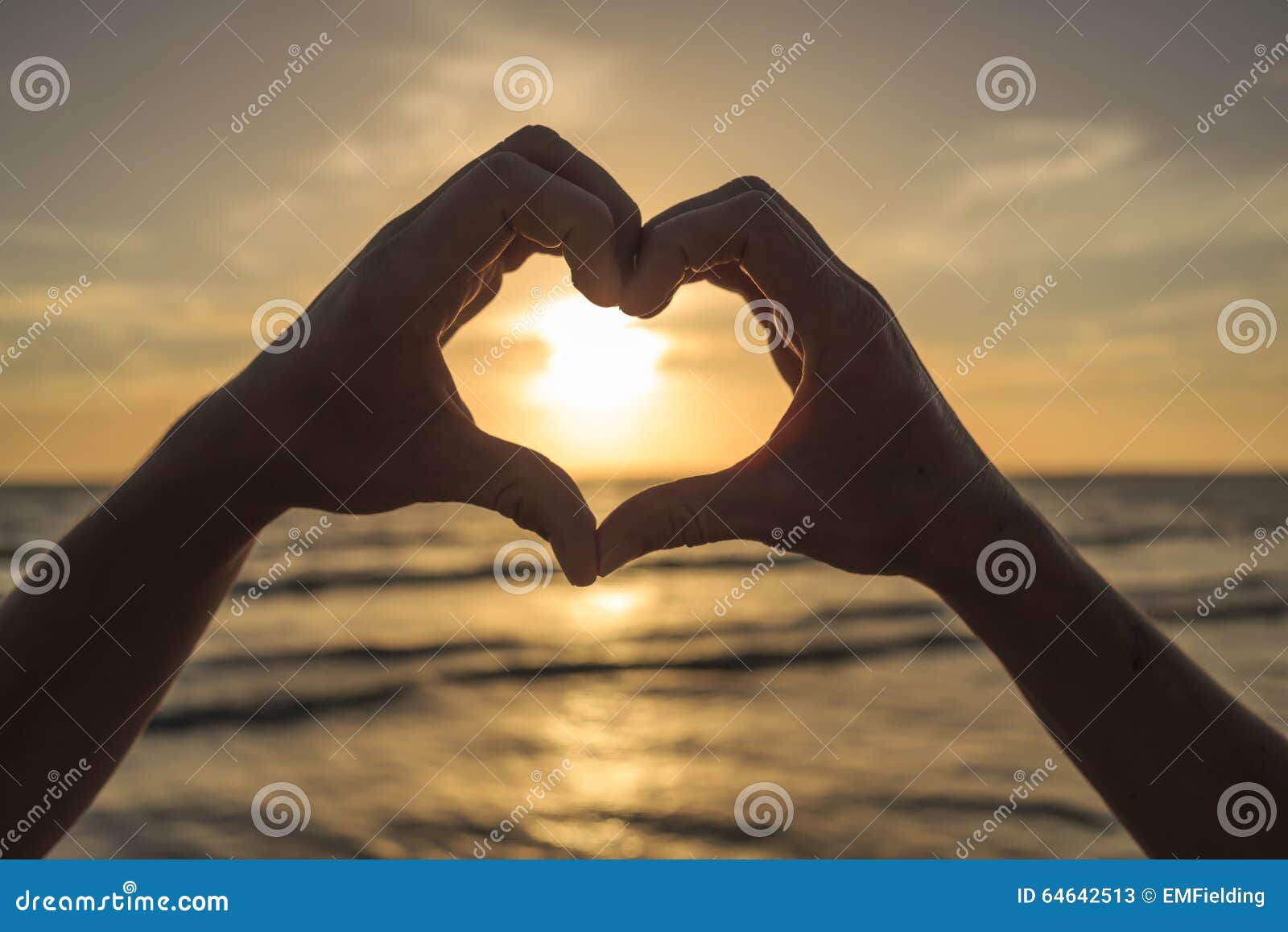 Hands Forming Heart Around Sunset Stock Image - Image of dusk, waves ...