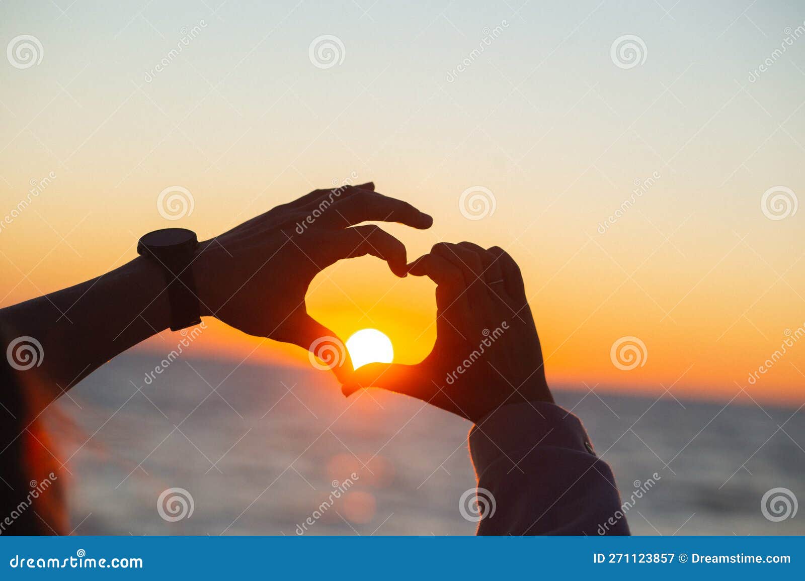Hands Forming a Heart Shape with Sunset Silhouette on a Sea Stock Image ...