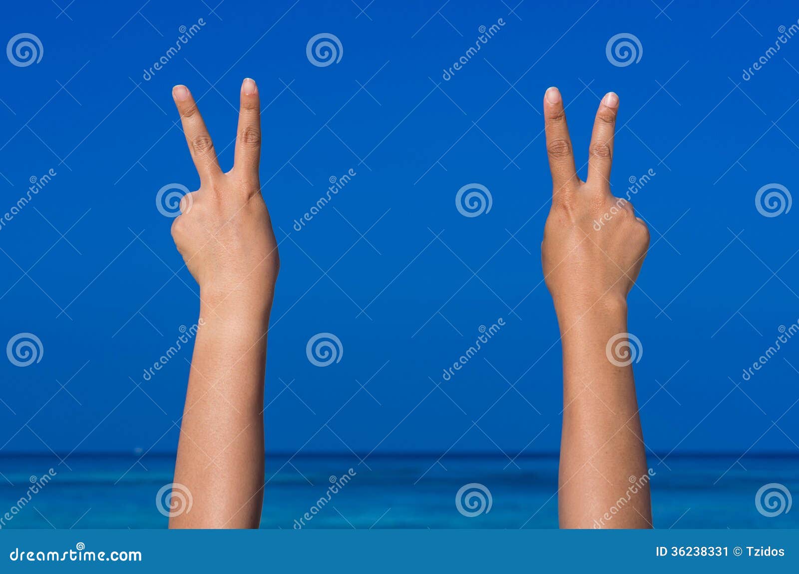 Hands Forming Number 2 with Blue Sea and Sky Stock Image - Image of ...