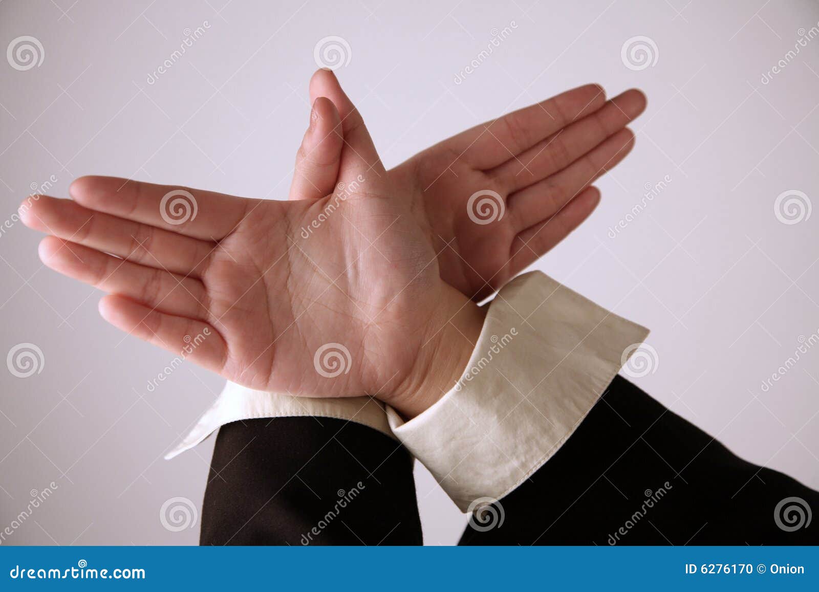 Hands forming wings stock photo. Image of texture, sleeve - 6276170