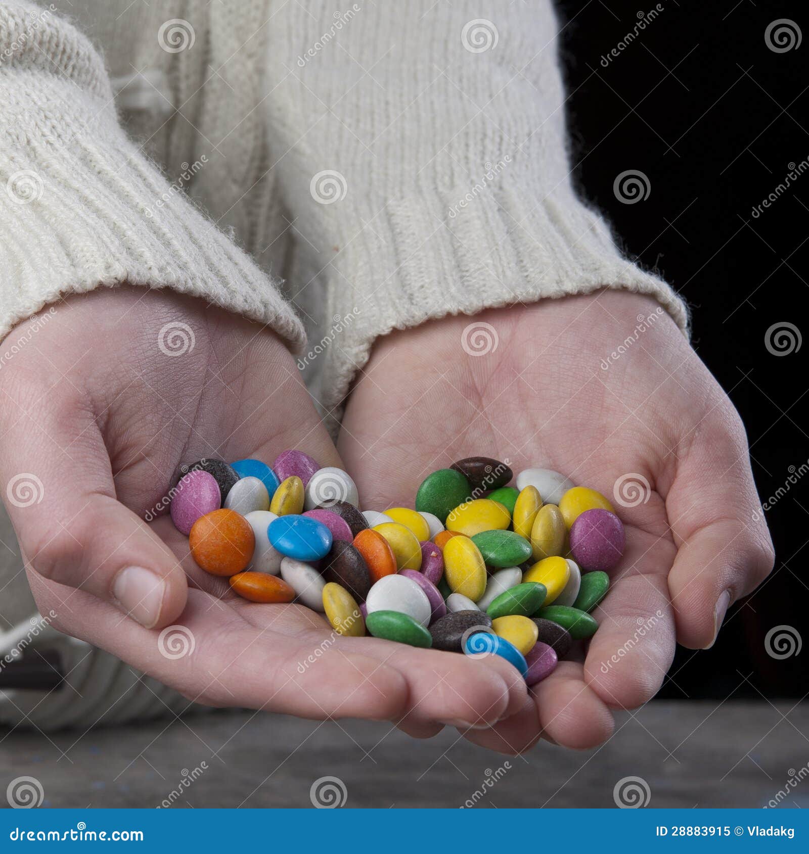 Hands full of sweets stock image. Image of bunch, full - 28883915