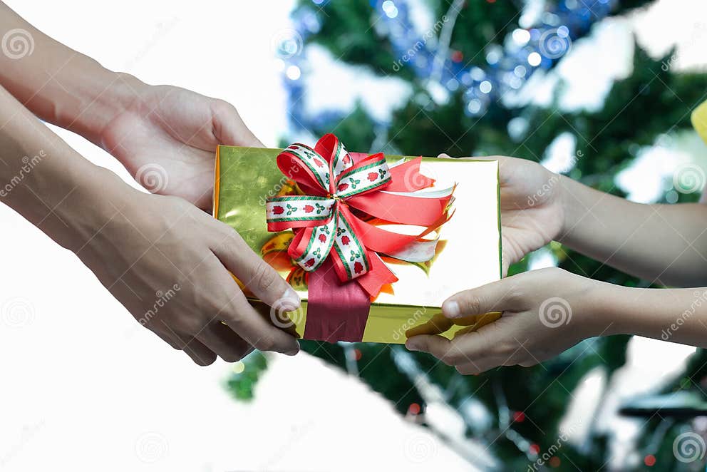 Hands Giving and Receiving a Present Stock Image - Image of surprise ...