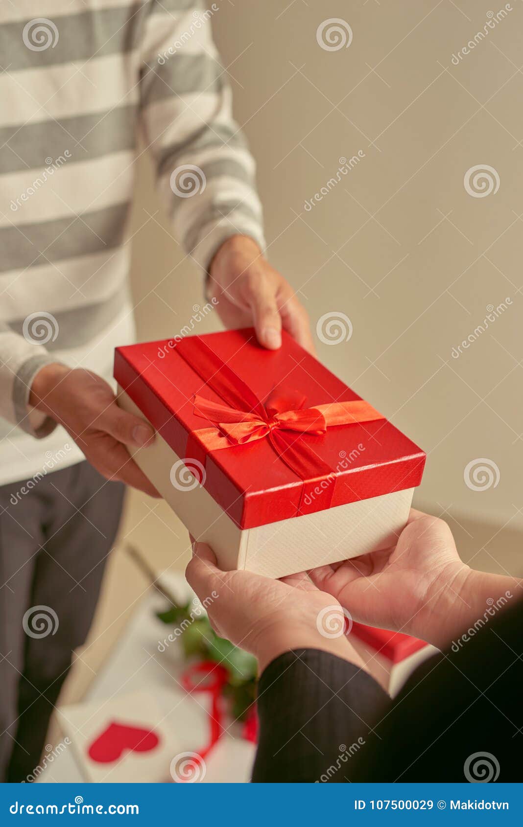 Hands Giving and Receiving a Red Present Stock Image - Image of home ...