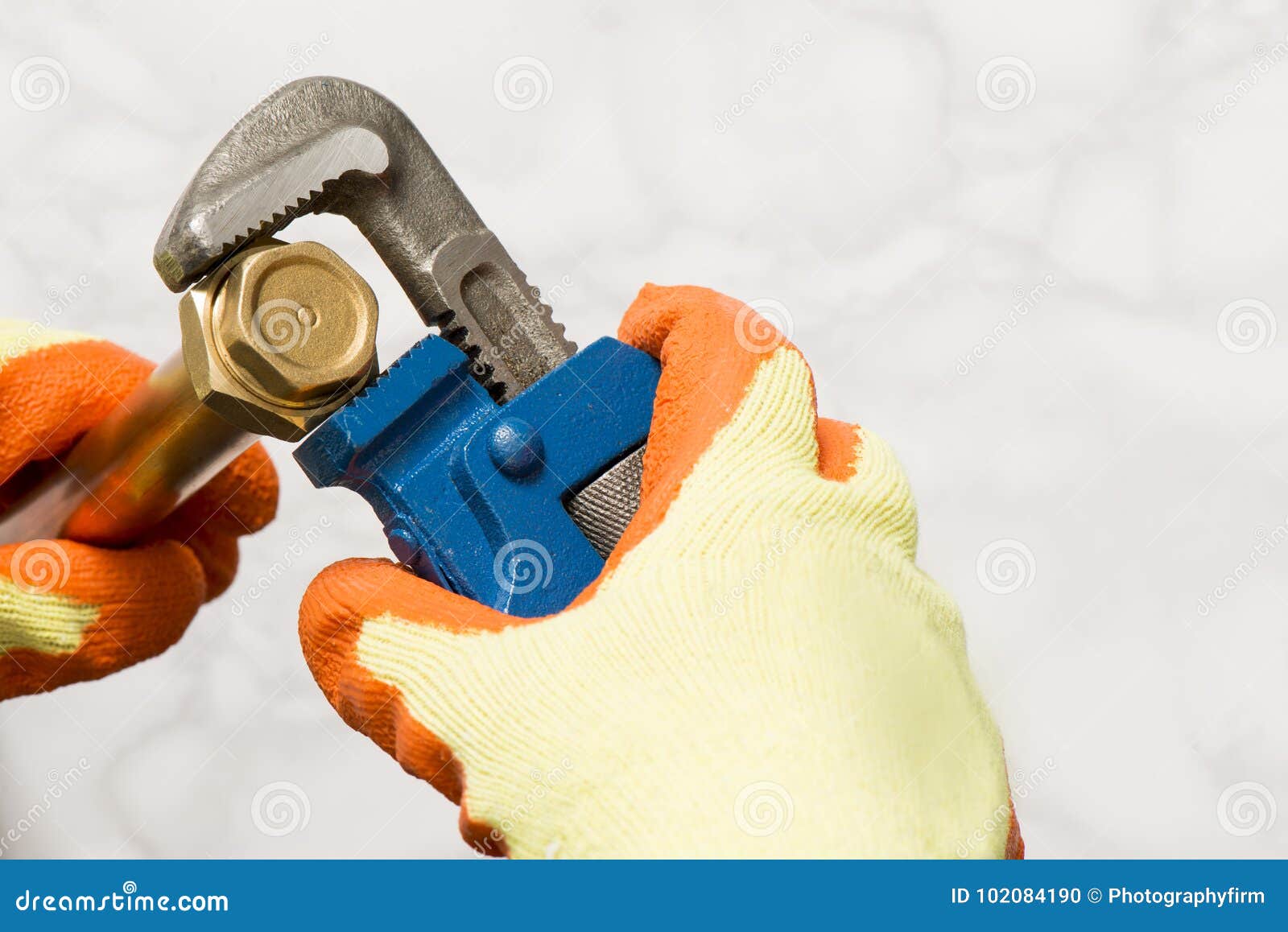 Hands in Gloves Turning a Nut with a Pipe Wrench Stock Photo - Image of ...