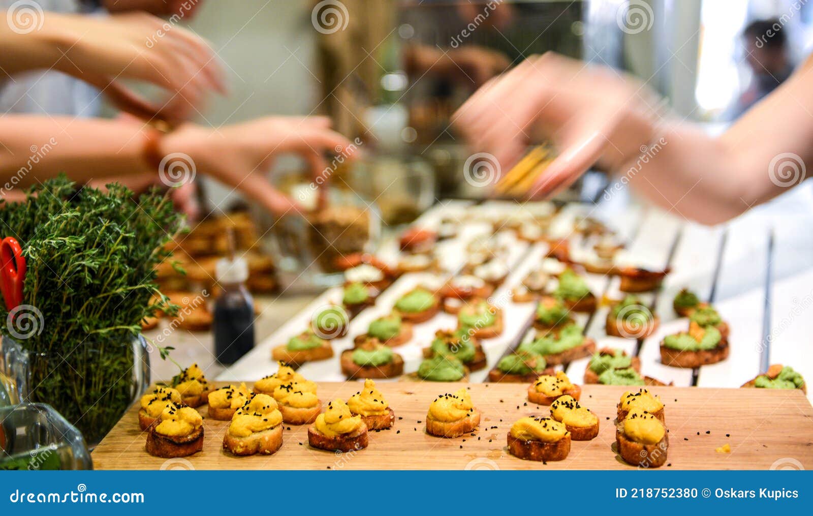 Hands Grabbing Snacks from Table in Blurred Motion Stock Photo - Image ...