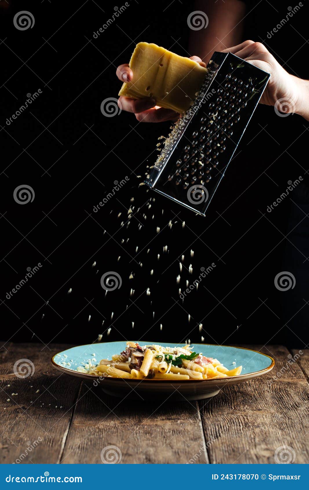 Hands Grating Cheese Over the Pasta Dish Stock Photo - Image of italian ...