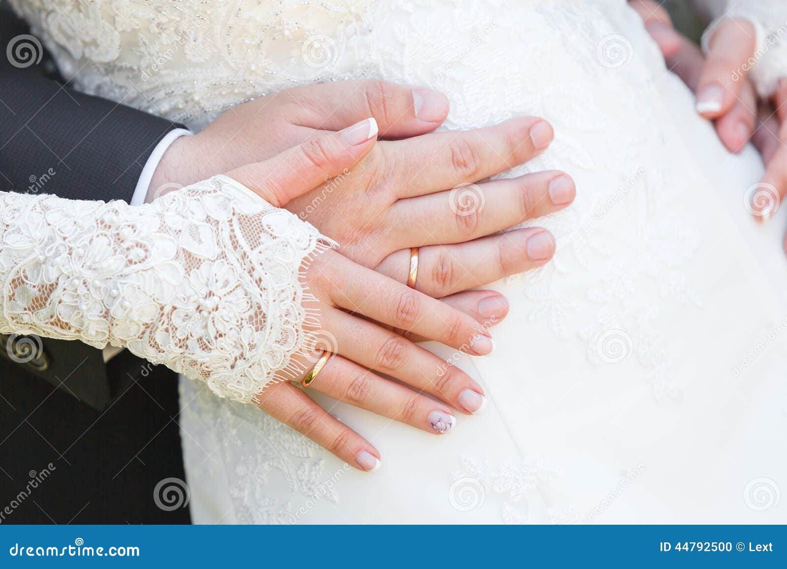 Hands of the Groom and Bride with Wedding Rings Stock Photo - Image of ...