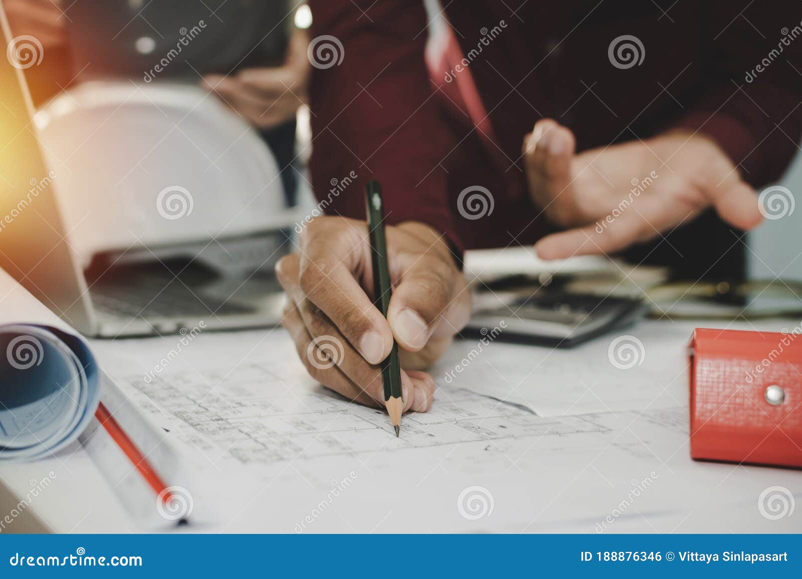 Group Of Engineer Checking The Blueprint On The Table And Talking About ...