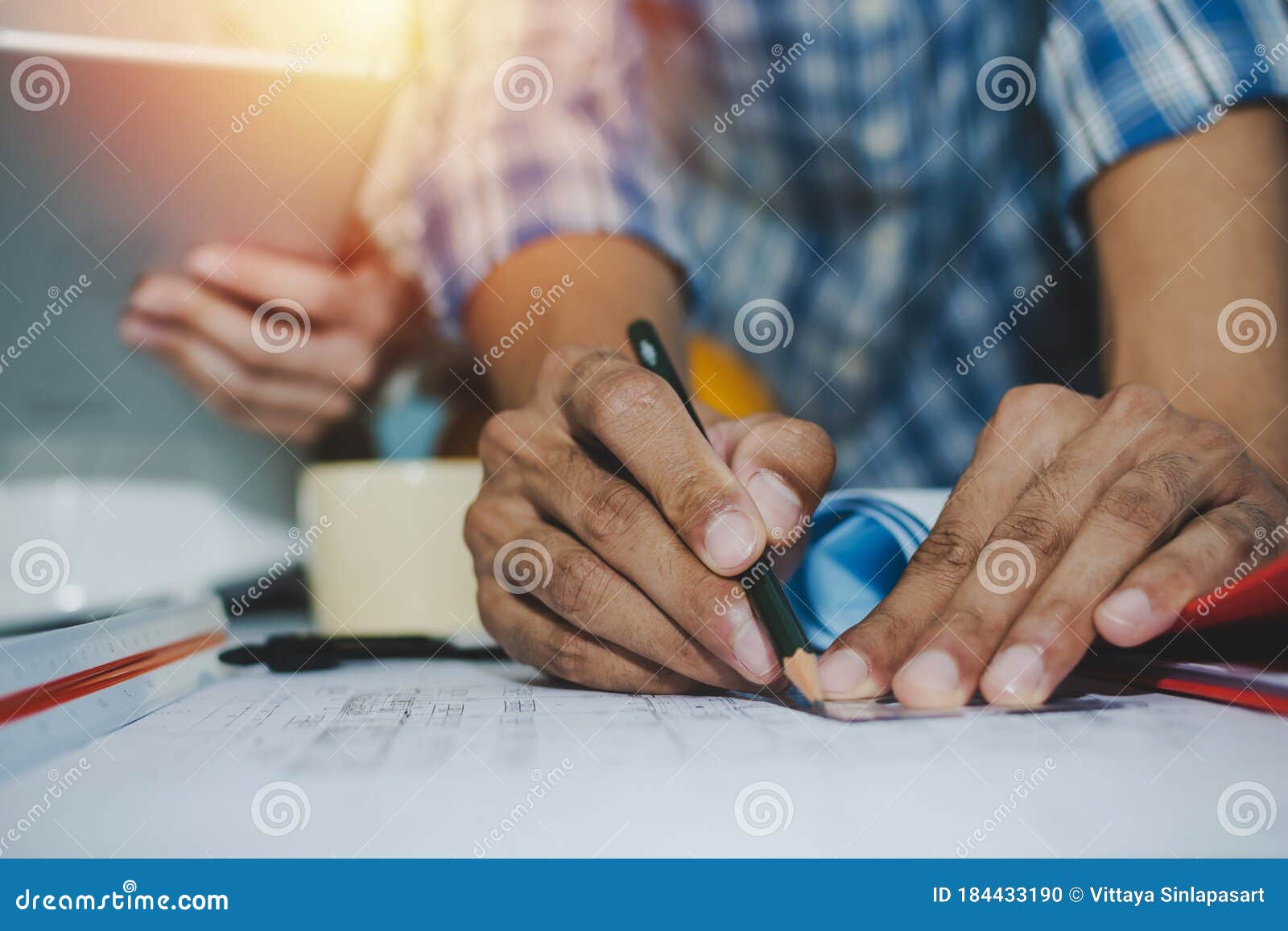 Group Of Engineer Checking The Blueprint On The Table And Talking About ...