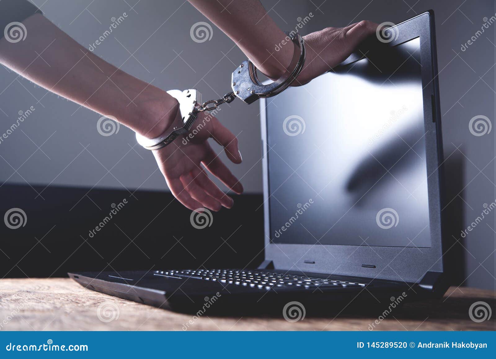 Hands in Handcuffs with Laptop. Cyber Crime Concept Stock Photo - Image ...