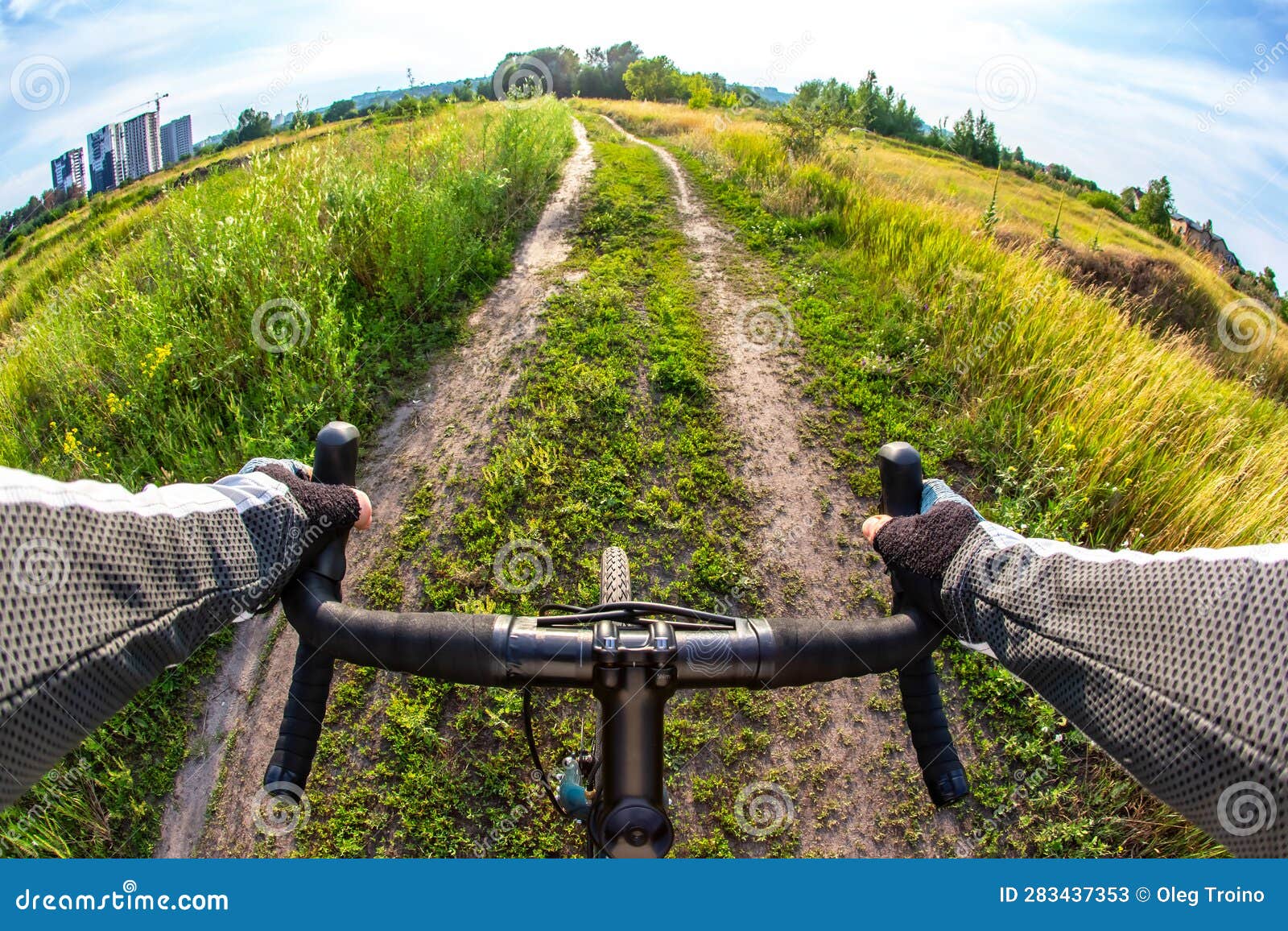 Hands on the Handlebars of a Bicycle of a Cyclist Riding Along a Trail ...
