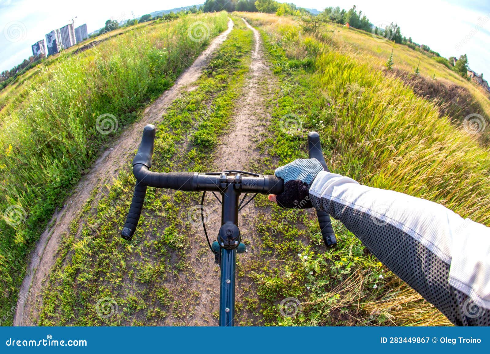 Hands on the Handlebars of a Bicycle of a Cyclist Riding Along a Trail ...