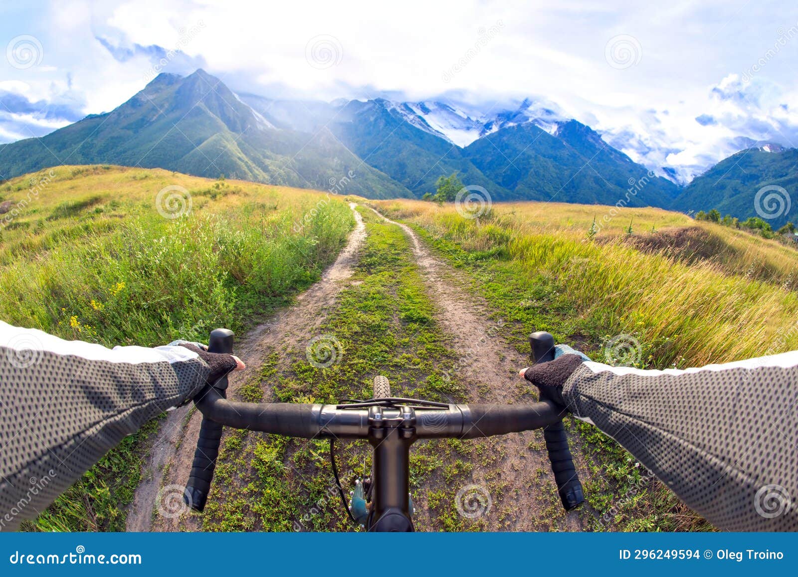 Hands on the Handlebars of a Bicycle of a Cyclist Riding Along a Trail ...
