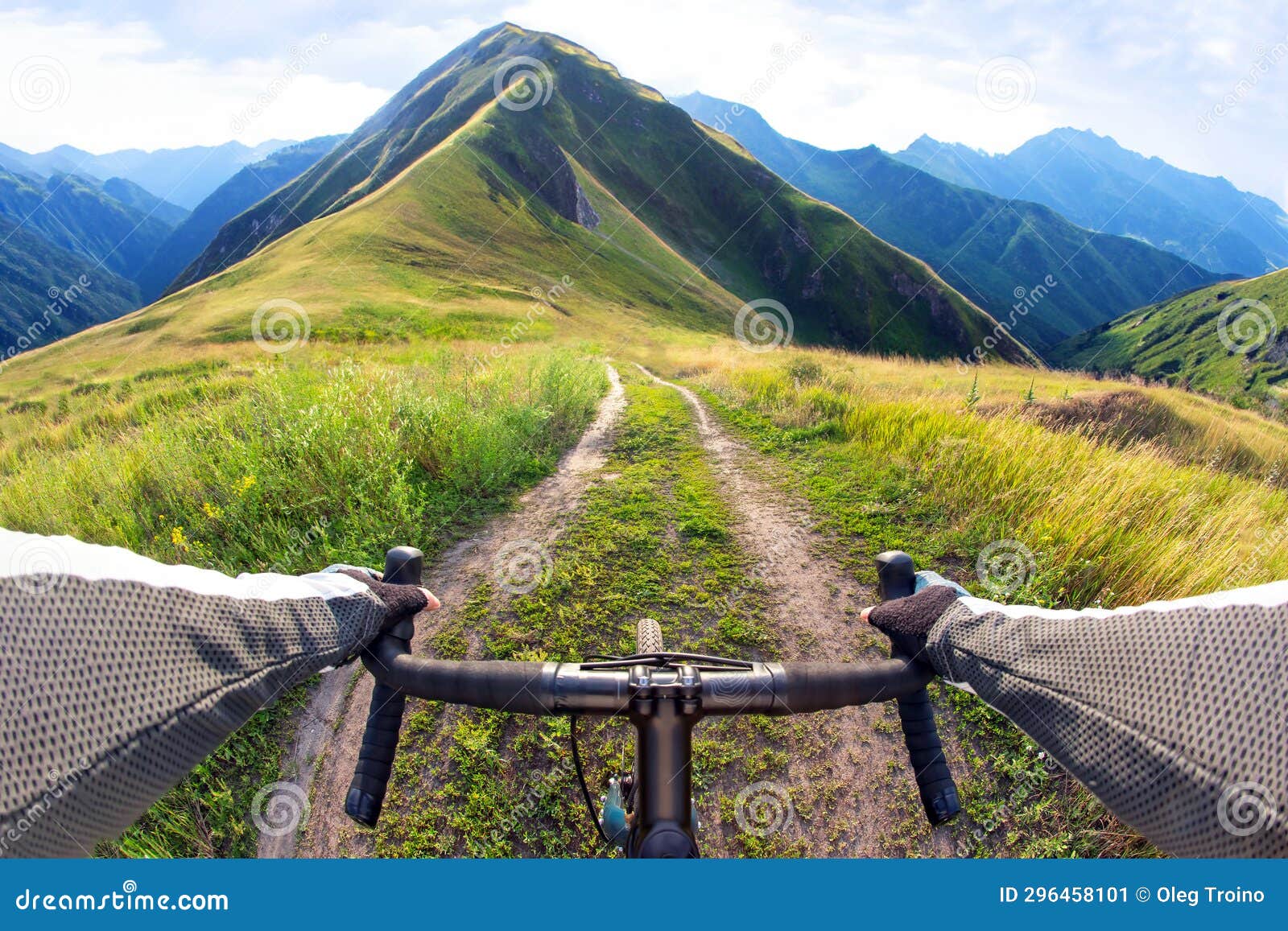 Hands on the Handlebars of a Bicycle of a Cyclist Riding Along a Trail ...
