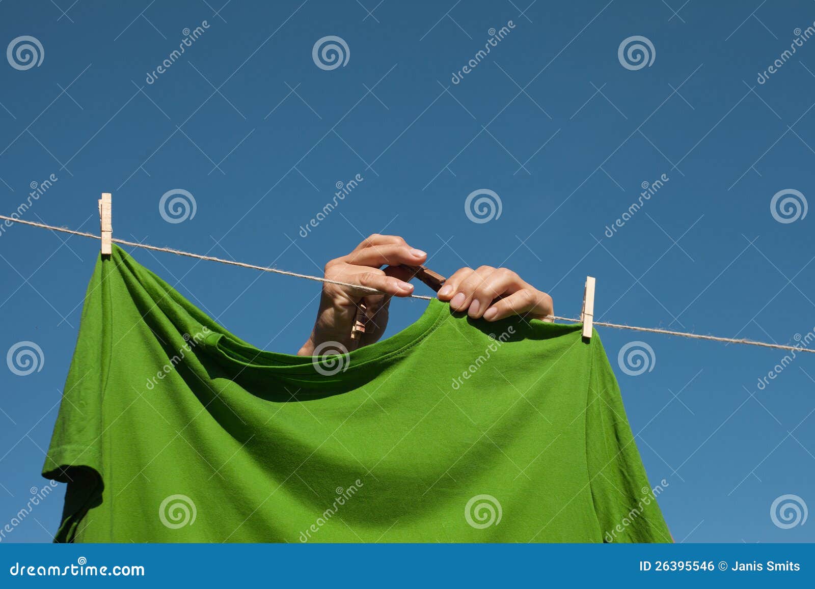 Hands hanging clothes. stock photo. Image of tshit, clothes - 26395546