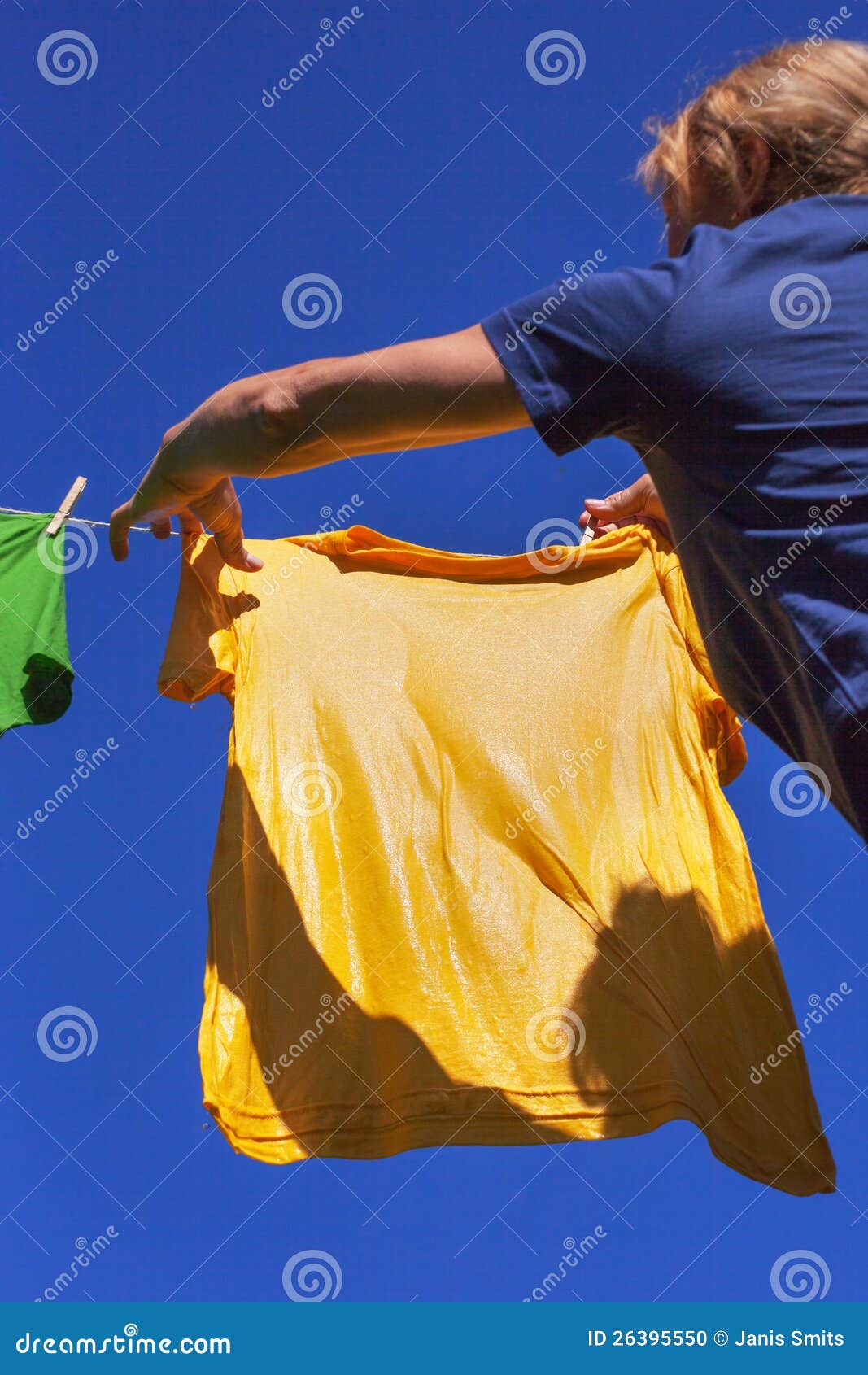 Hands hanging clothes. stock photo. Image of laundry - 26395550