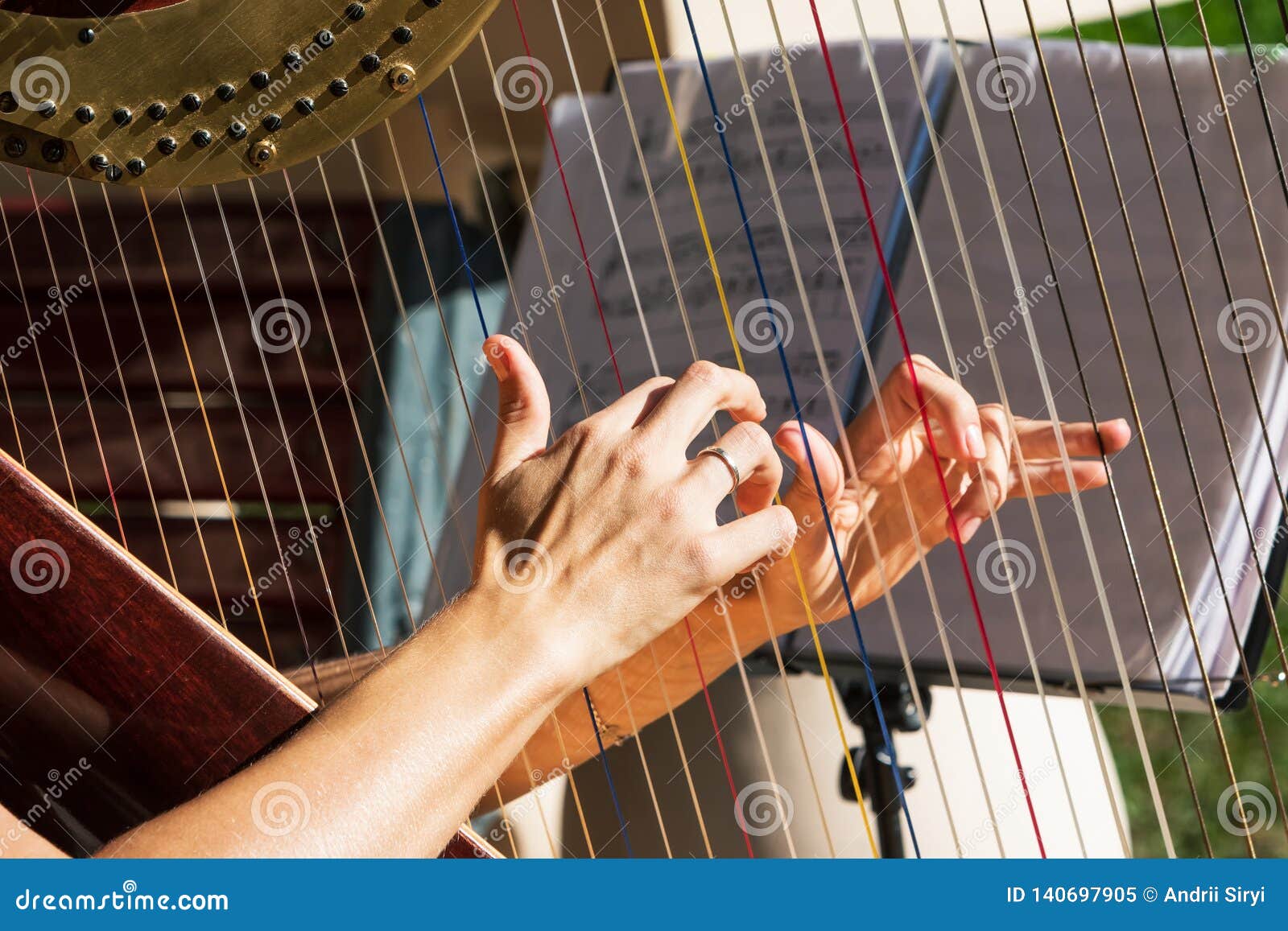 Hands on harp strings stock image. Image of harpist - 140697905