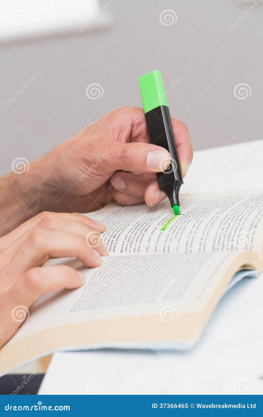 Hands Highlighting Text in Book on the Table Stock Image - Image of ...