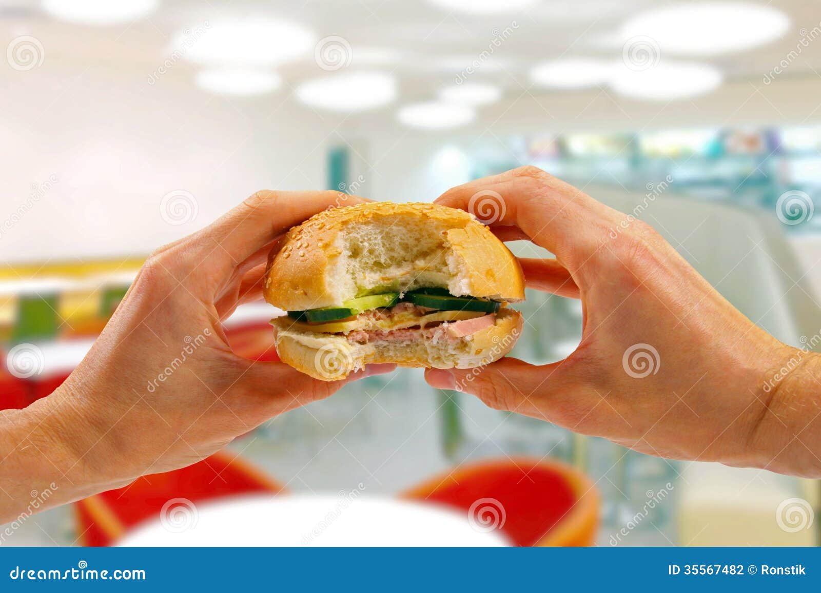 Hands Hold a Burger in Fast Food Restaurant Stock Photo - Image of meal ...