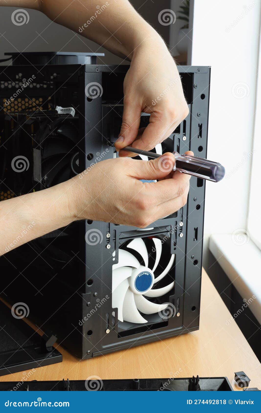 Hands Hold Screwdriver and from Fan of Computer Cooling System Stock ...