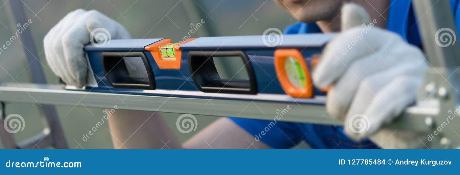 Hands Hold a Tool for Measuring the Level of Construction, a Long Photo ...
