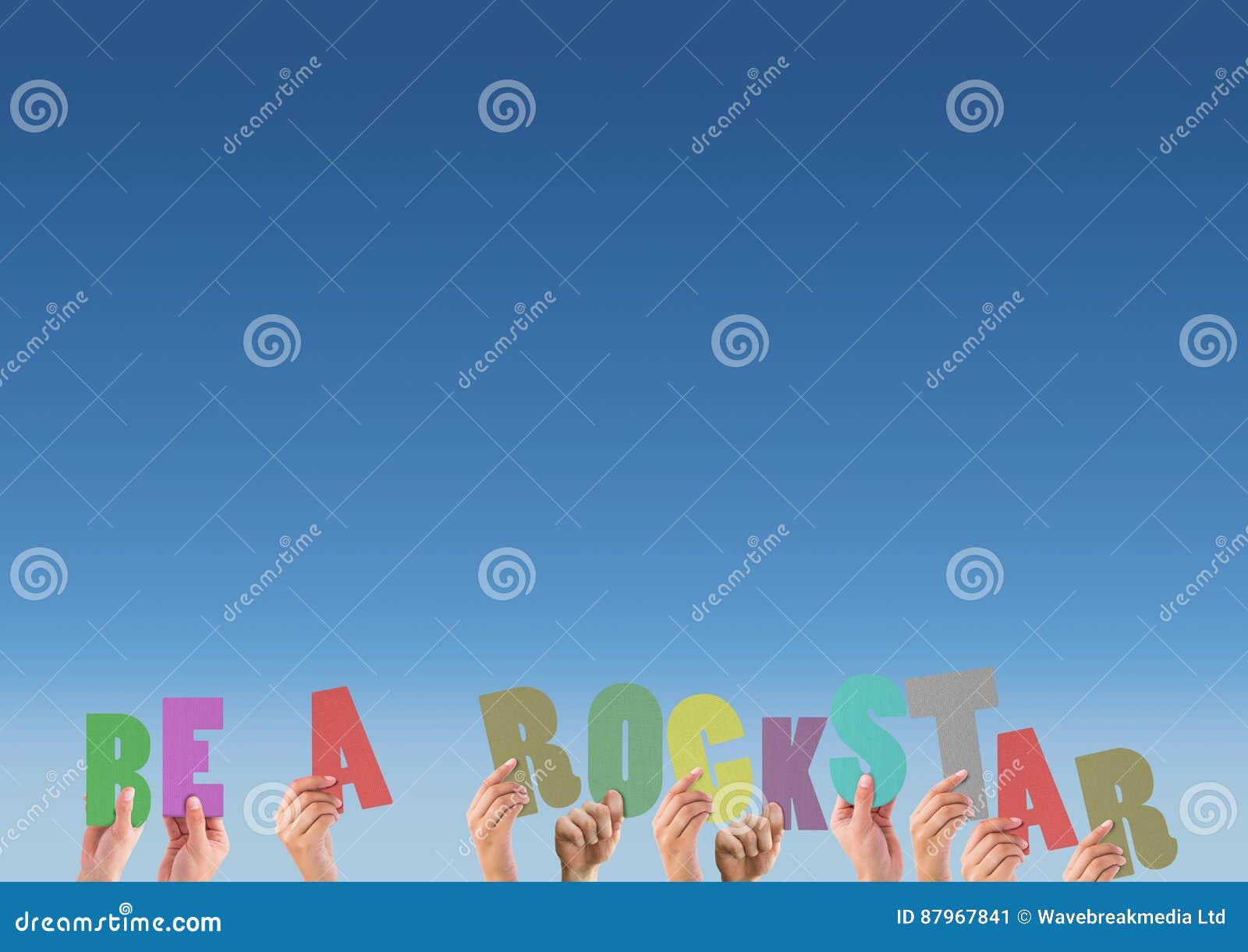 Hands Holding Alphabet of Be a Rockstar Stock Image - Image of ...