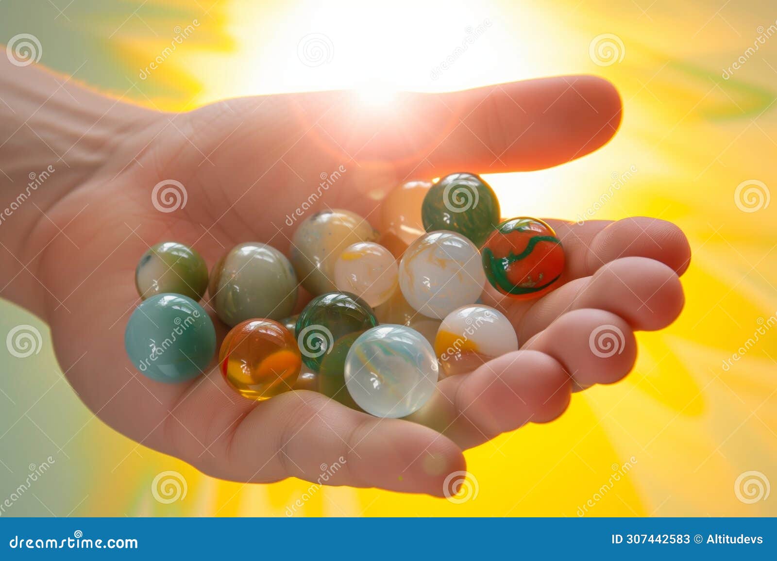 Hands Holding Assorted Marbles Against a Bright Backdrop Stock Image ...