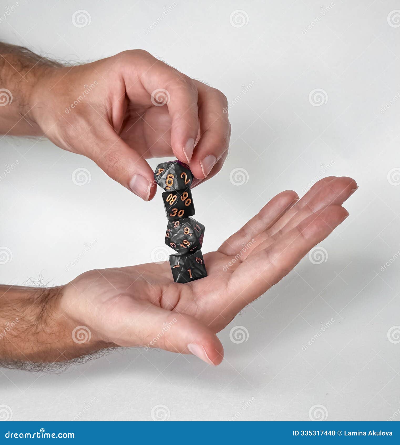 Hands Holding and Balancing Polyhedral Dice Set for Tabletop Gaming ...