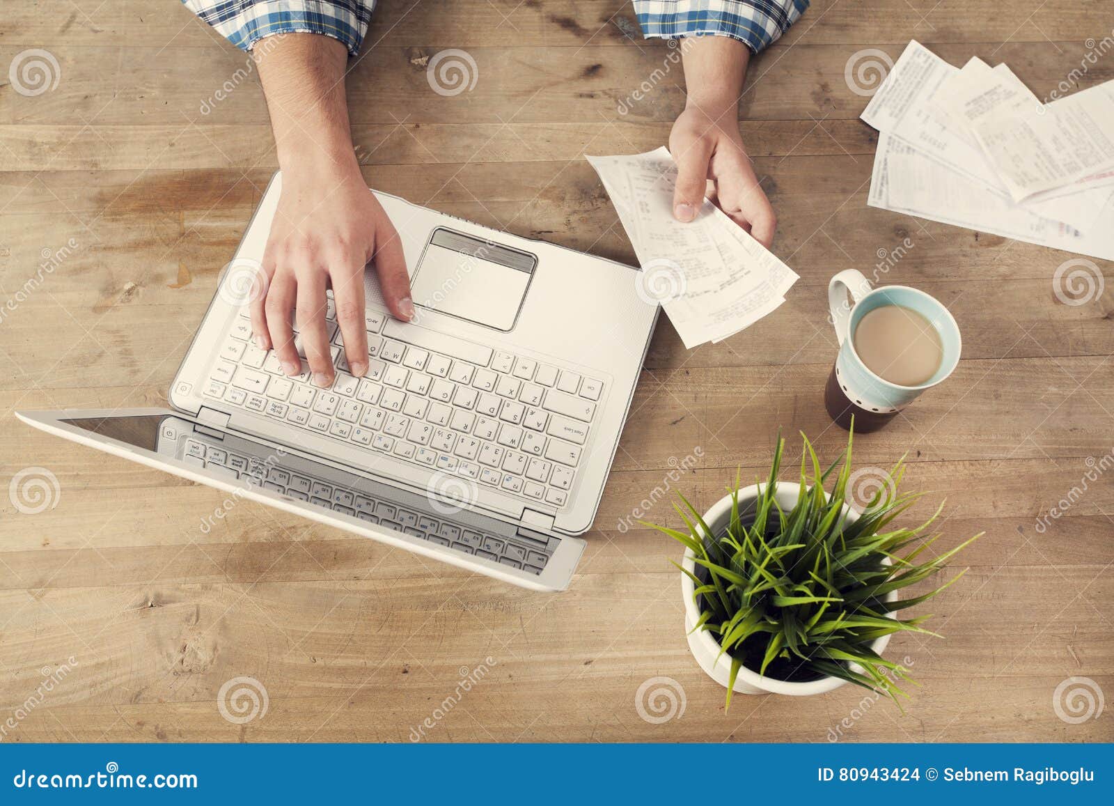 Hands Holding Bills and Paying Bills on Computer Stock Photo - Image of ...