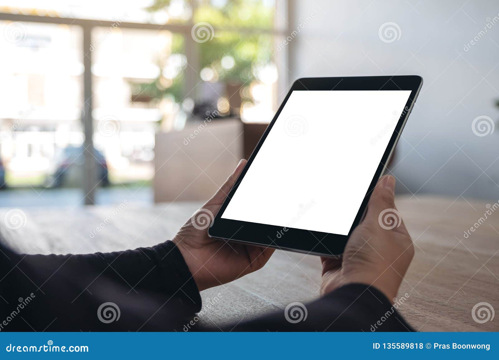 Hands Holding Black Tablet Pc with Blank White Screen while Sitting in ...