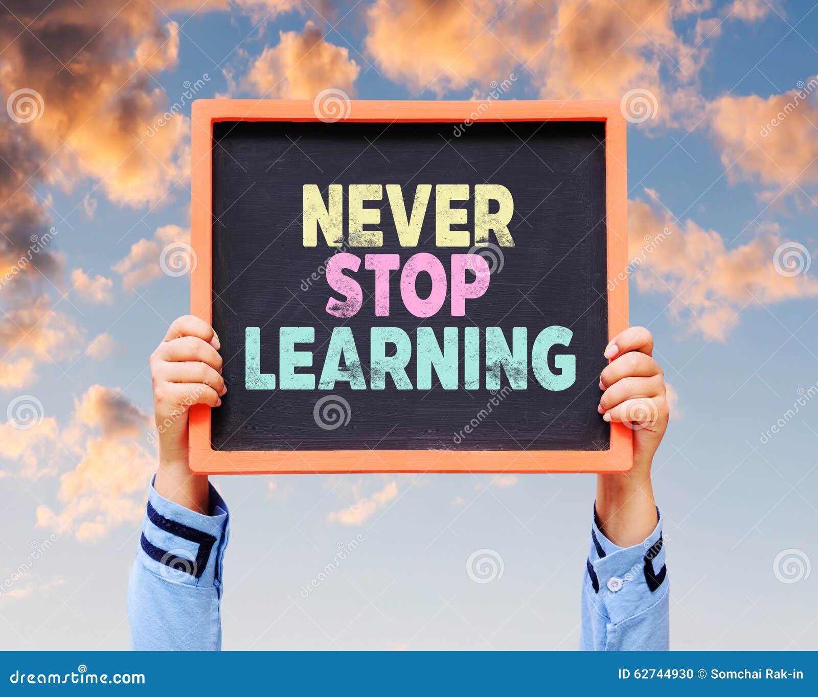Hands are Holding the Blackboard of Word Never Stop Learning Stock ...
