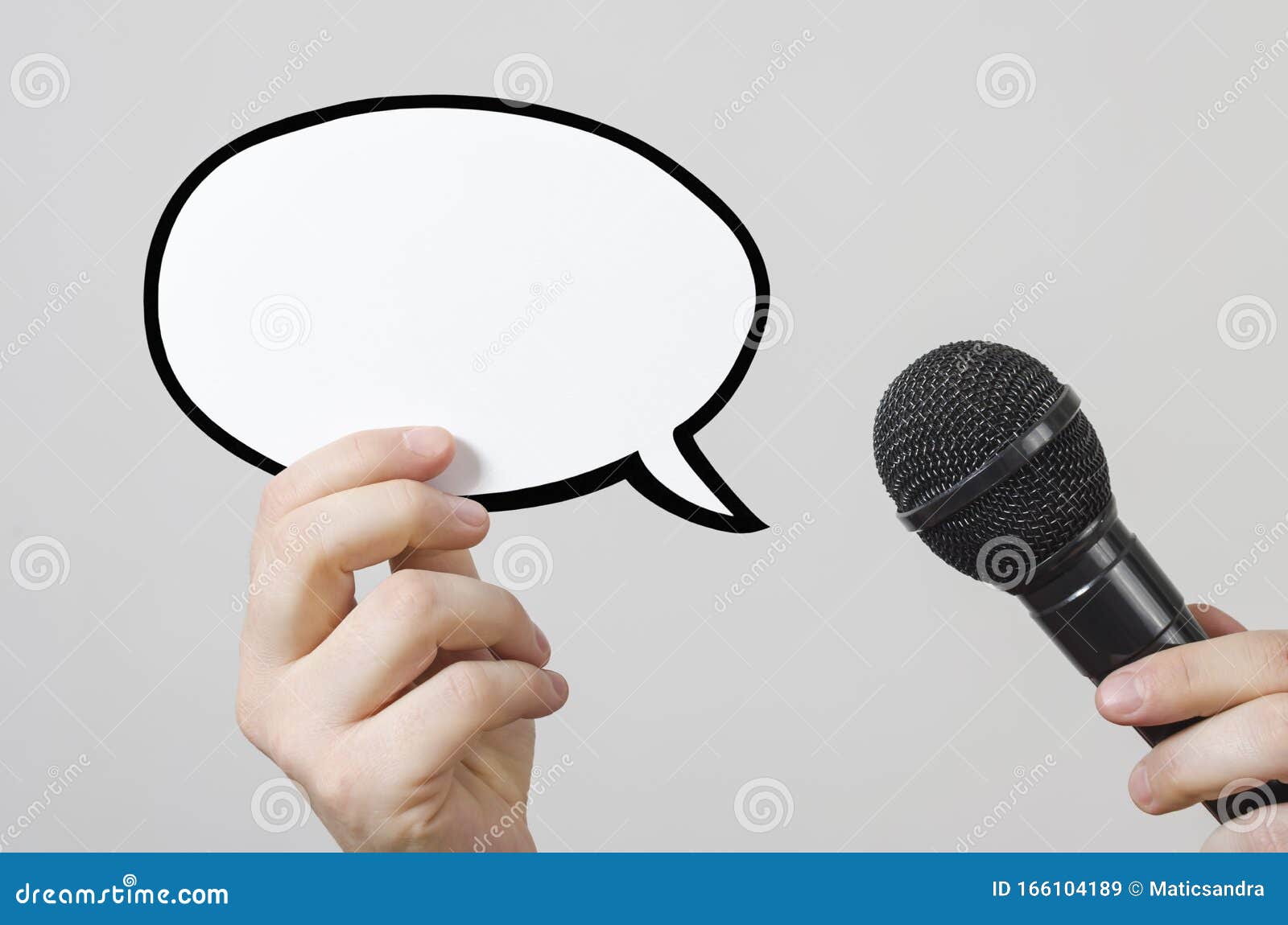 Hands Holding a Blank Speech Bubble and Microphone Stock Image - Image ...