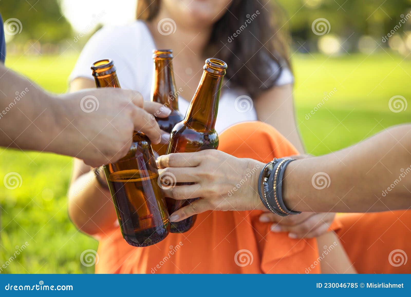 The Hands Holding Bottles with Beer and Cheers Stock Image - Image of ...
