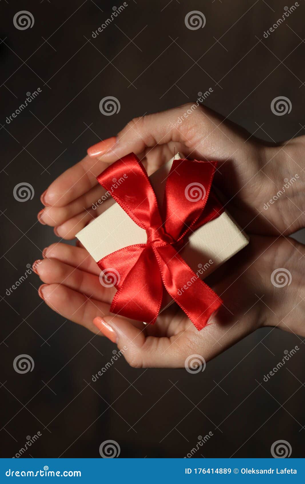 Hands holding a box. stock image. Image of horizontal - 176414889
