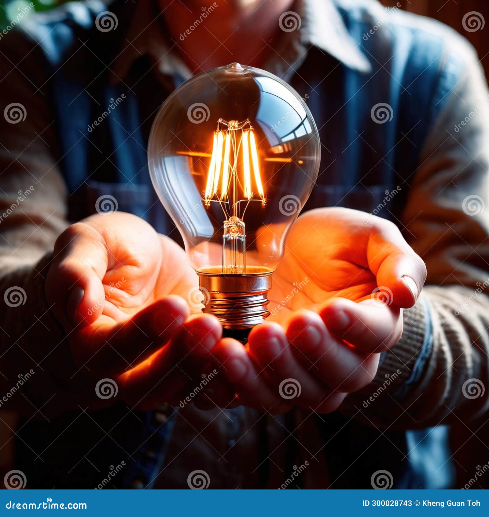 Hands Holding Bright Glowing Lightbulb, a Metaphor for Grapsing ...