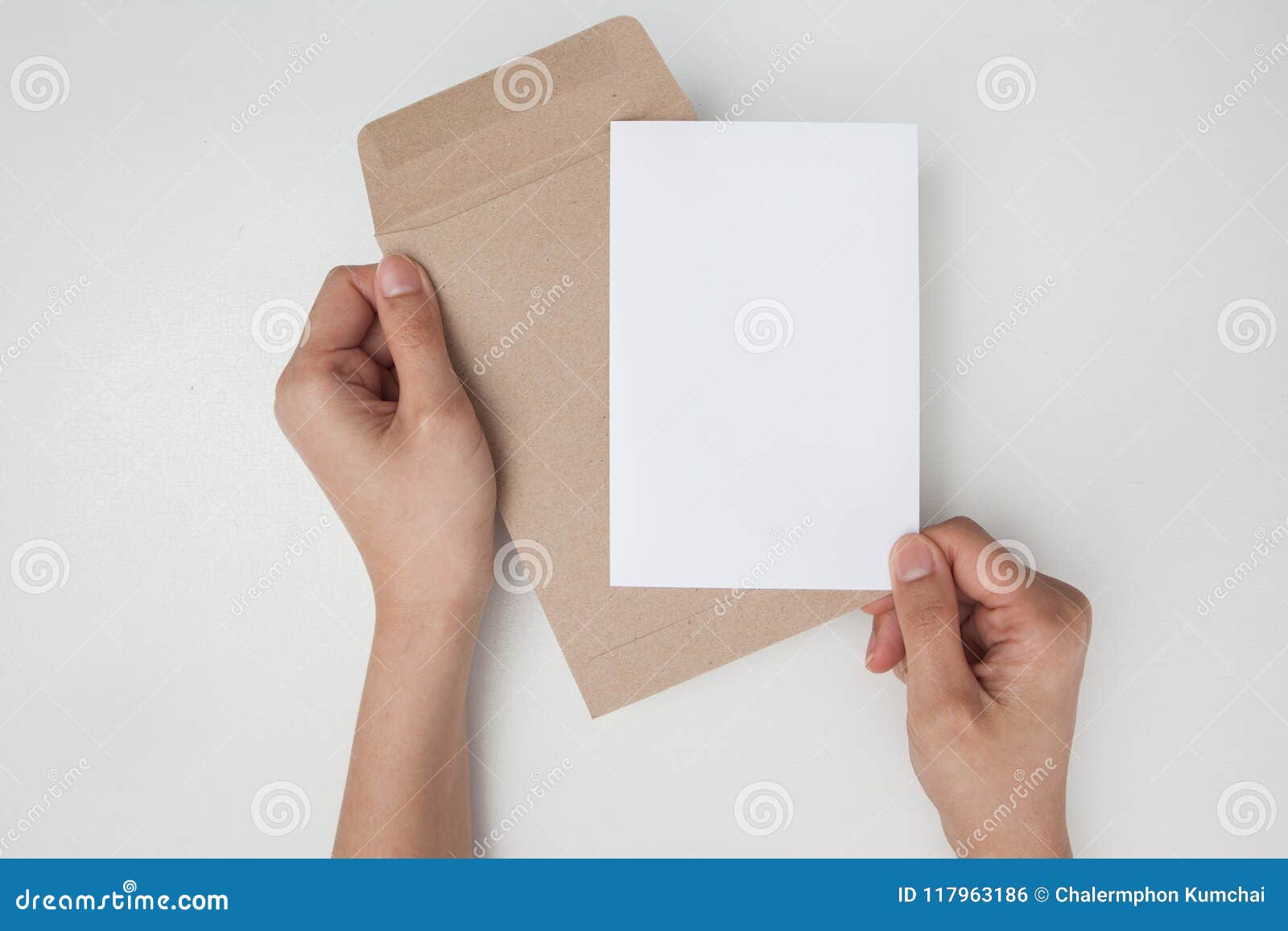 Hands Holding Brown Envelope with a Empty Paper on White Background ...