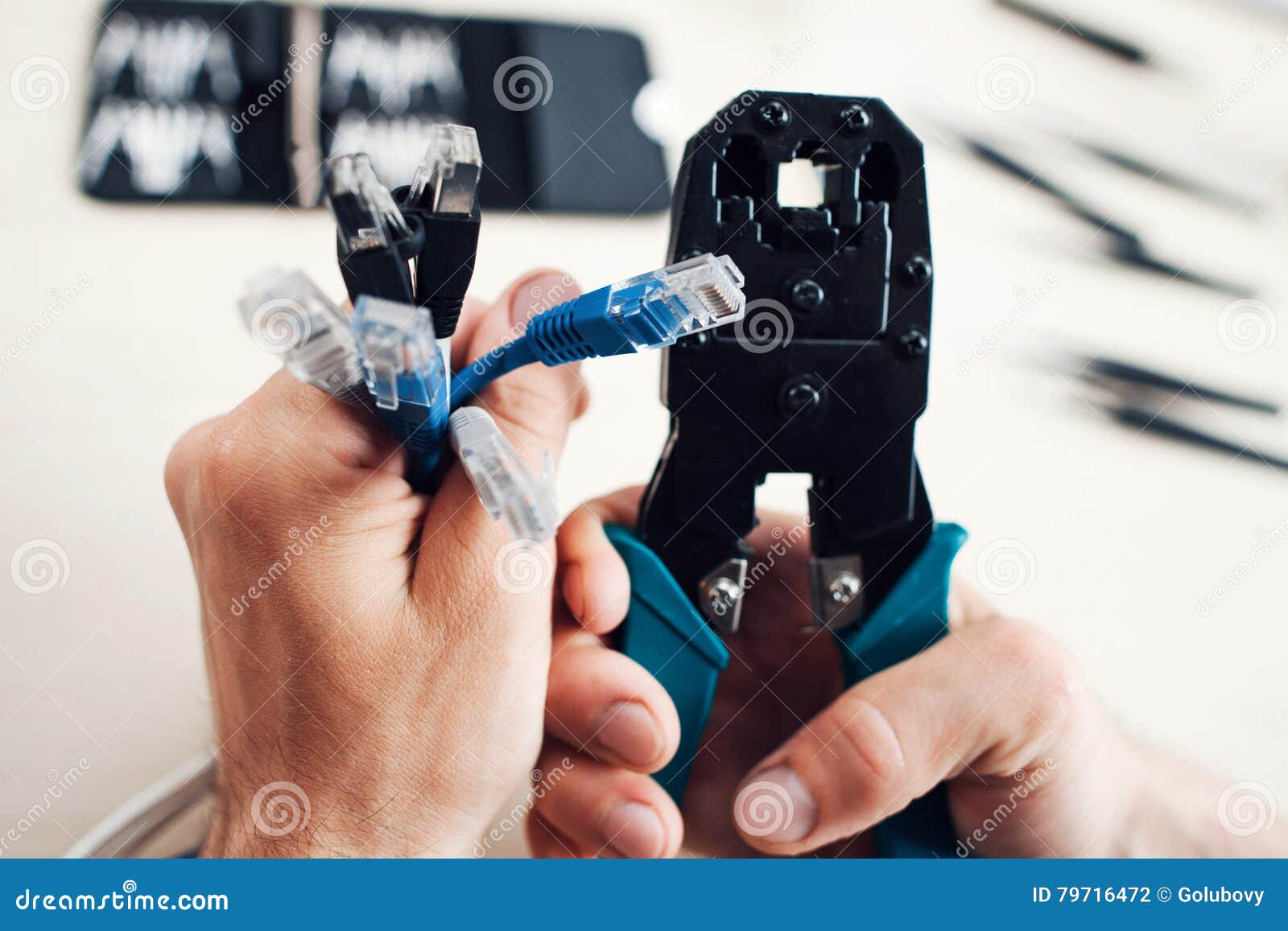 Hands Holding Cables and Forceps for Crimping Plug Stock Photo - Image ...