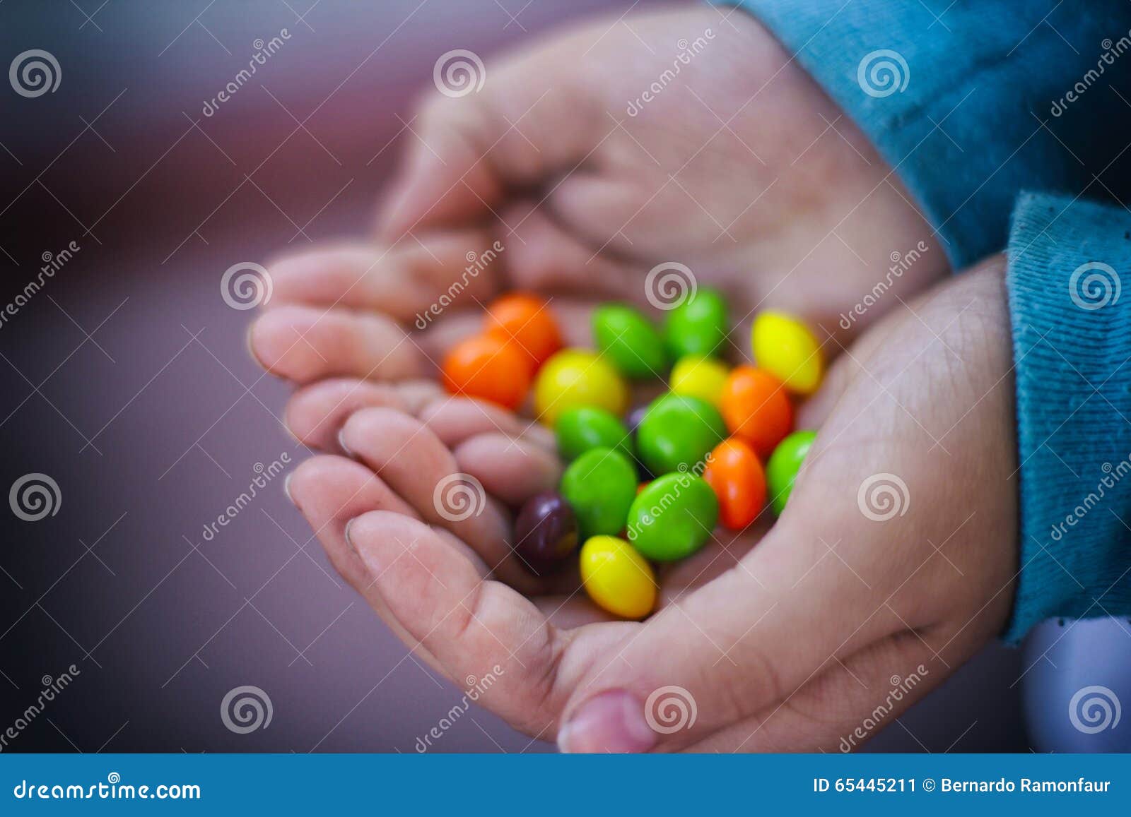 Hands holding candy stock image. Image of hands, confectionery - 65445211