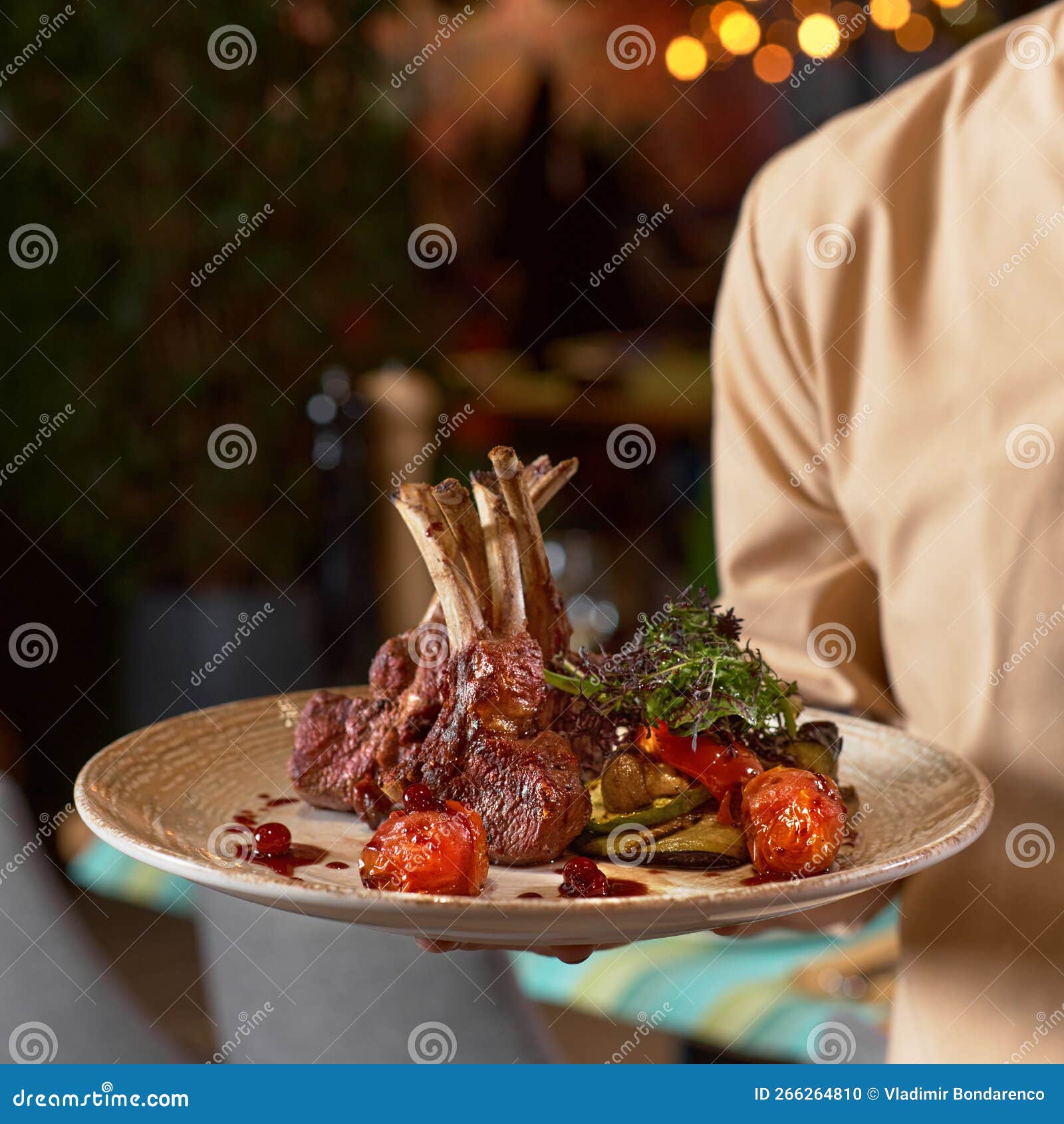 Hands Holding Cooked Tomahawk Long Bone Ribeye Steak on a Serving Board ...