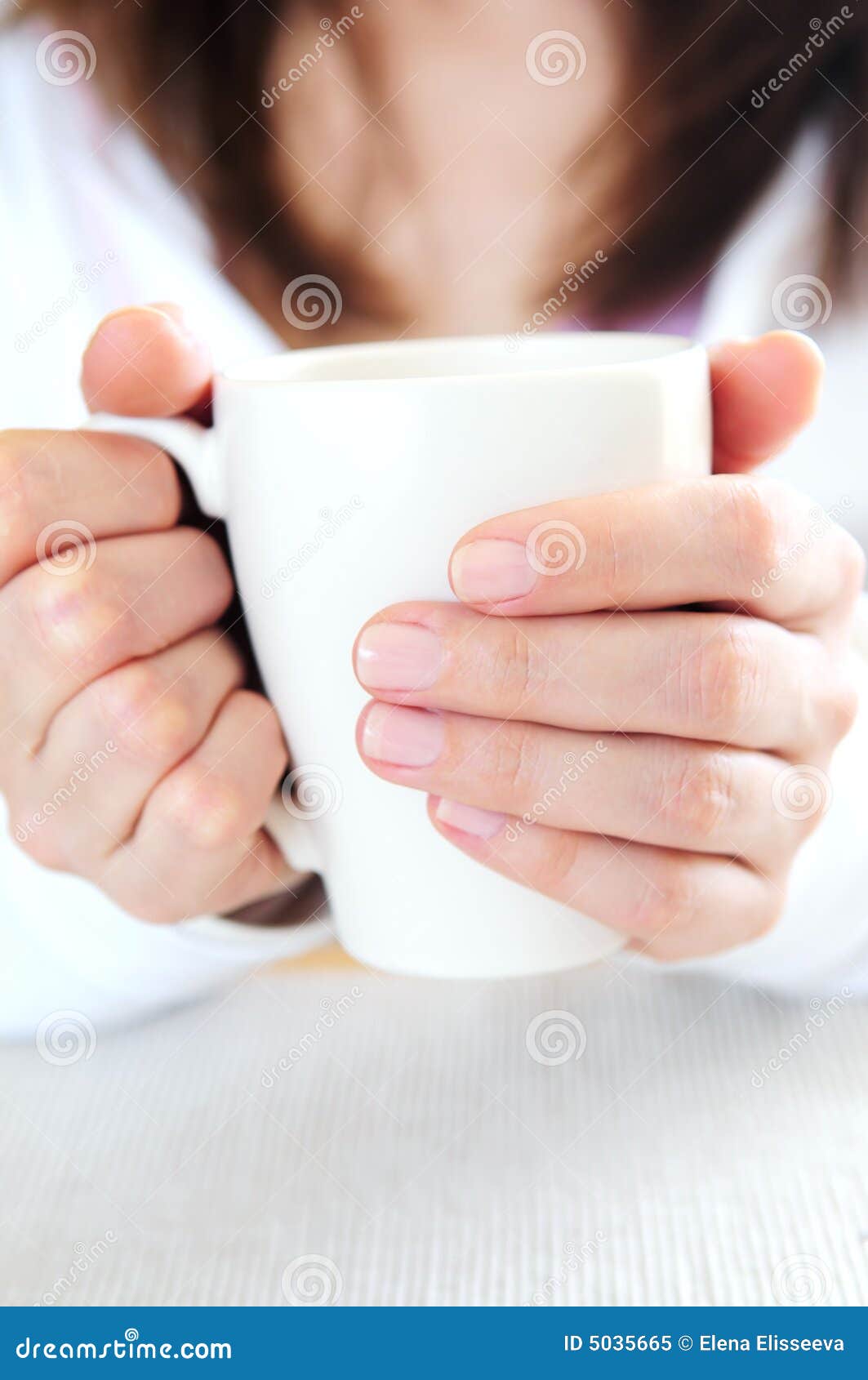 Hands holding a cup stock image. Image of coffee, manicured - 5035665