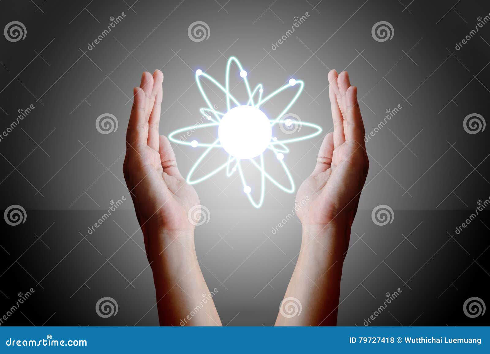 Hands Holding and Cupping a Glowing Atom Stock Photo - Image of atom ...