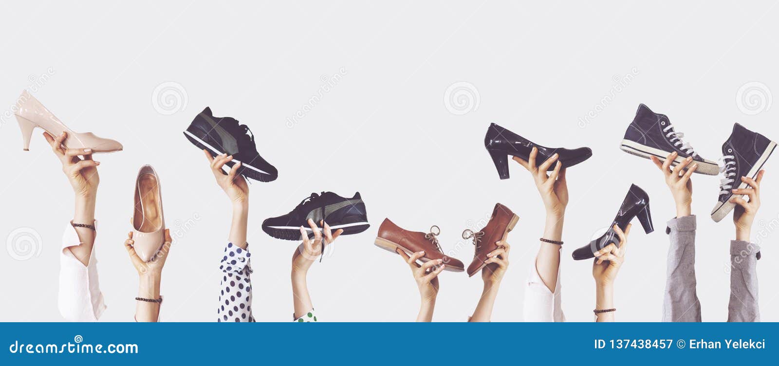 Hands Holding Different Shoes on Isolated Background Stock Image ...