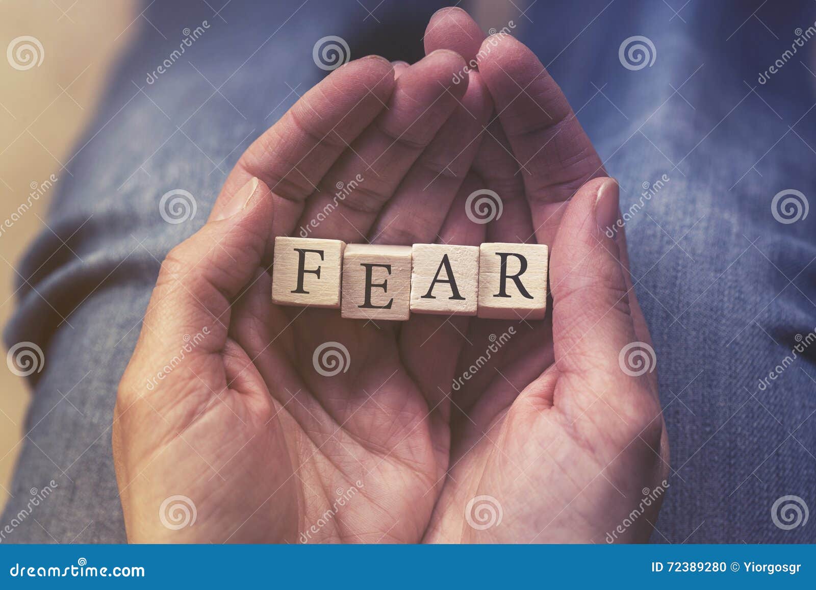 Hands holding Fear message stock photo. Image of woman - 72389280