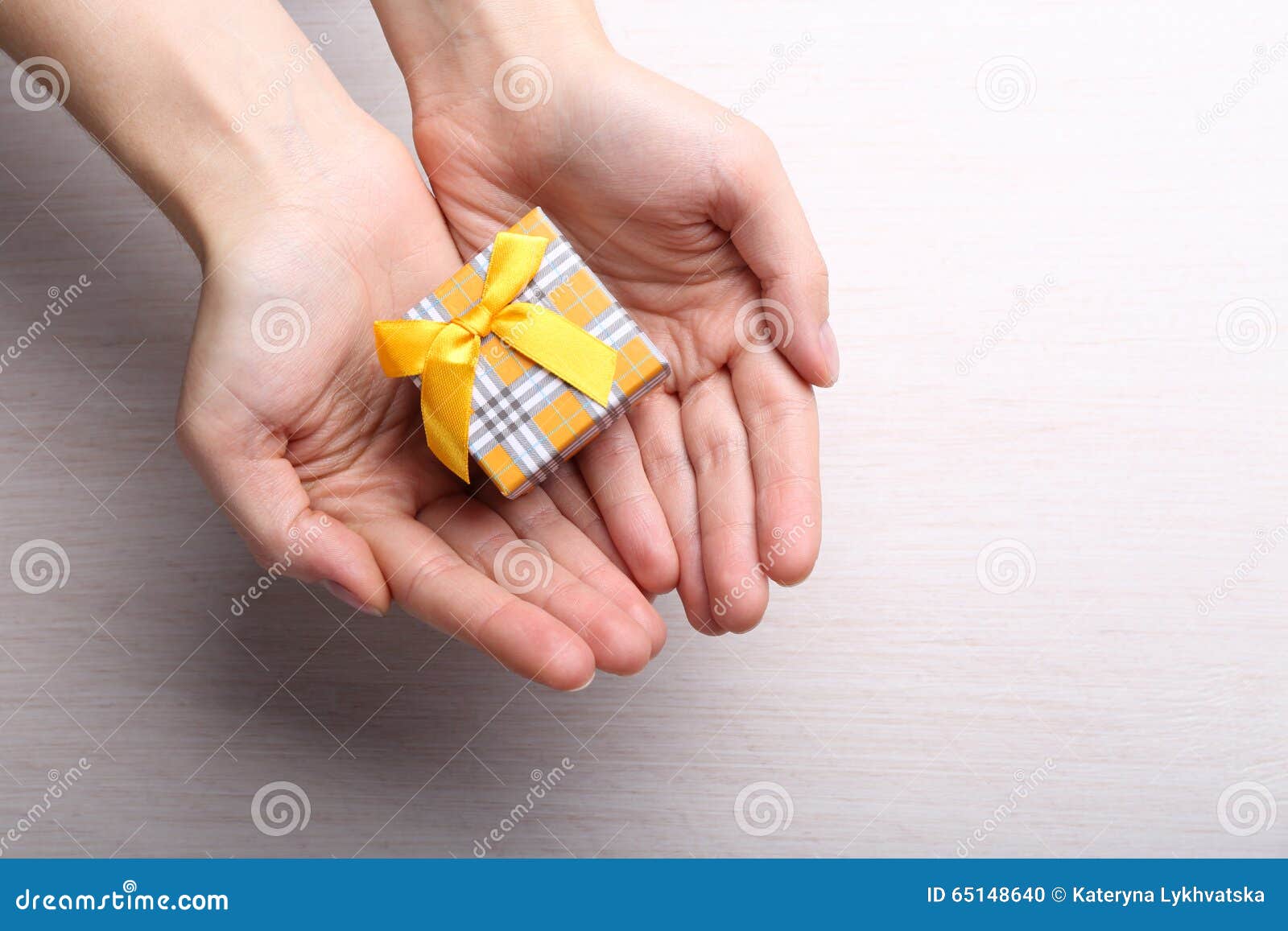 Hands holding gift box stock photo. Image of holding - 65148640