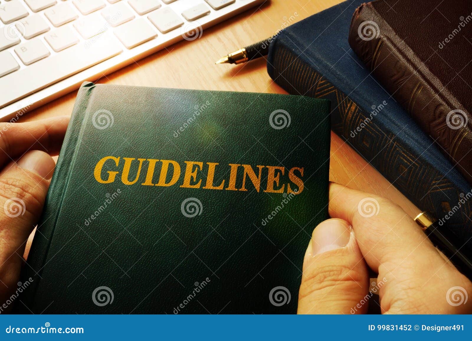 Hands holding Guidelines. stock photo. Image of practice - 99831452