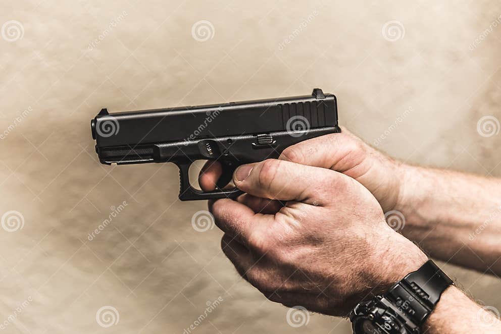 Hands Holding Gun with Finger on Trigger Stock Image - Image of target ...